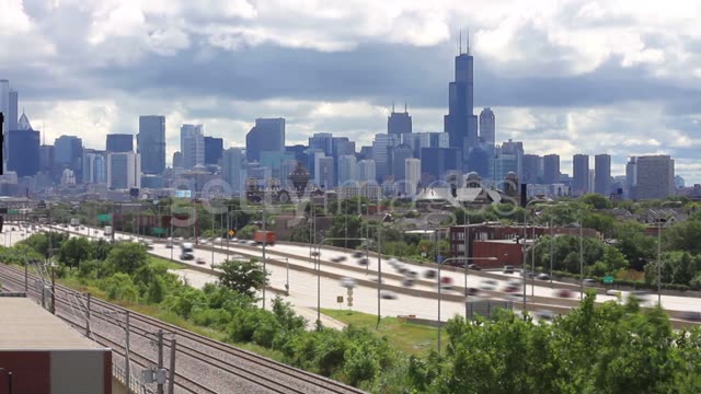 Time lapse of the busy Kennedy Expressway traffic with clouds rolling ...
