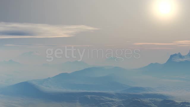 Blue mountain peaks shrouded in a thick white mist. Camera swiftly ...