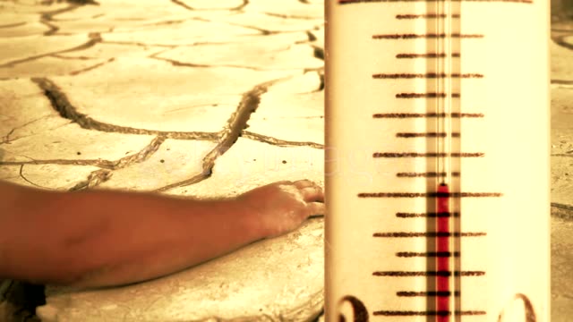 Fast rising temperature on the thermometer& hand scraping the cracked ...