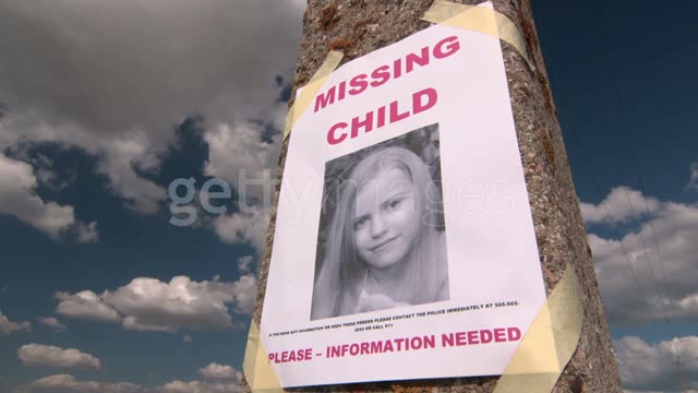 Missing person poster with photo of little girl are posted on pole time ...