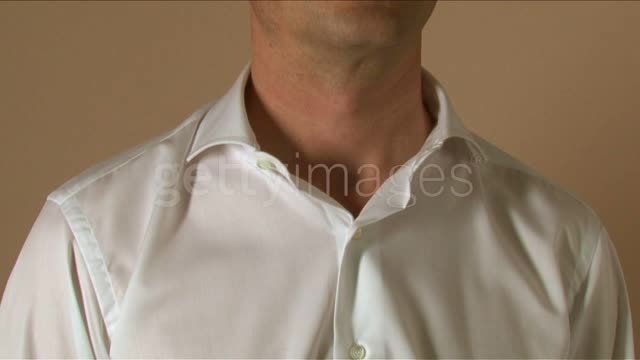 Tailor measuring different parts or the body for a shirt production ...