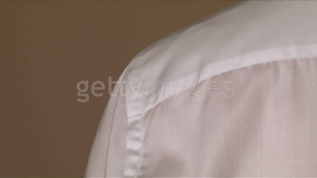 Tailor measuring different parts or the body for a shirt production ...