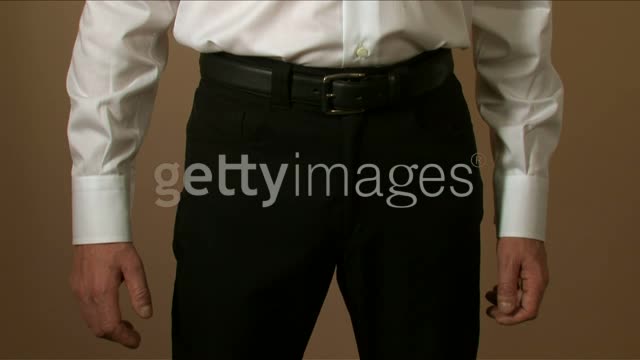 Tailor measuring different parts or the body for a shirt production ...