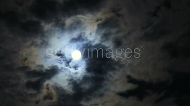 Scary Full Moon in a Cloudy Night.Very detailed lunar surface with its ...