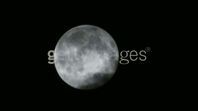 Scary Full Moon in a Cloudy Night.Very detailed lunar surface with its ...