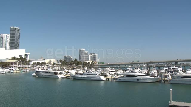 Panning view of the Bayside Marina in Miami with a lot of vessels on a ...