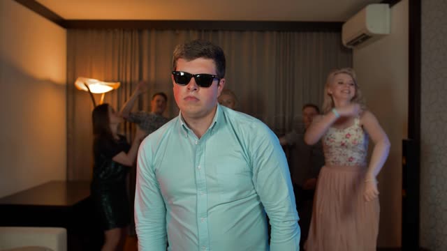 Cheerful nerd male with glasses dancing and partying 비디오&오디오 ...