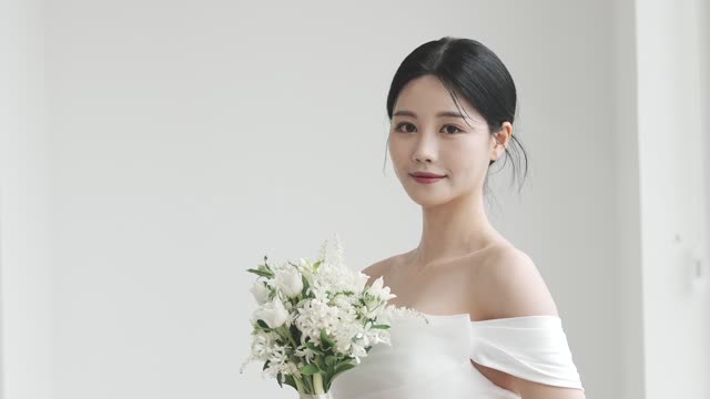 Wedding photography on wedding day - Smiling bride holding bouquet ...