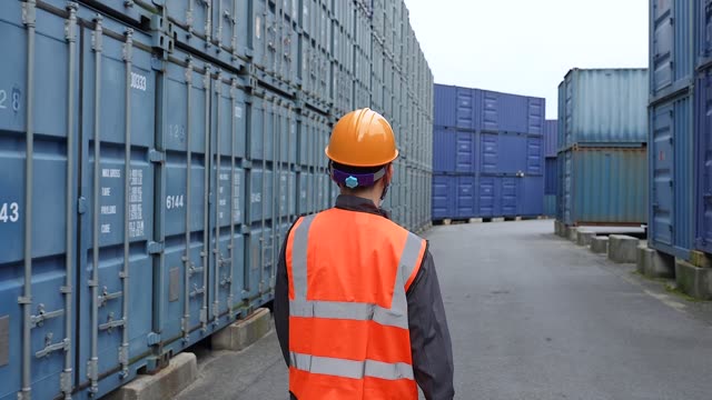 Business Logistics - Man wearing working clothes, safety helmet and ...