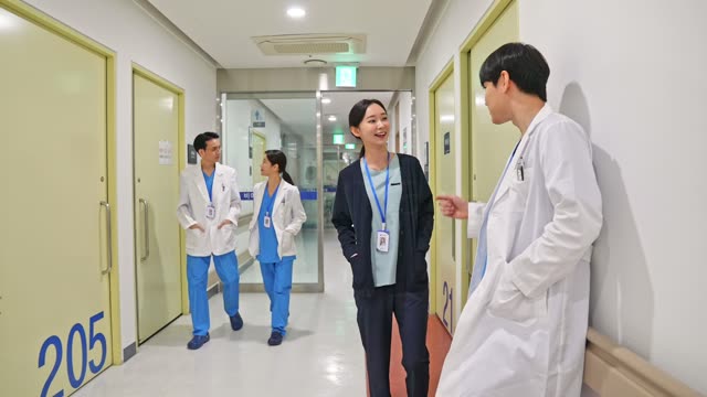 Hospital of Korea - Doctors and nurse having conversation and smiling ...
