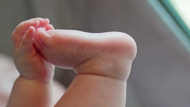 Seoul, House, newborn girl playing with toes on floor / South Korea 동영상 ...