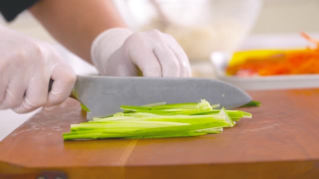 K-food - Cooking Class: Kimbap, cutting completed kimbap with knife ...