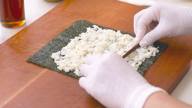 K-food - Cooking Class: Kimbap, placing kimbap ingredients on rice ...