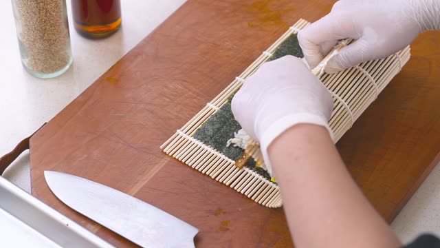 K-food - Cooking Class: Kimbap, rolling up kimbap after placing all ...