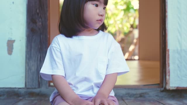 Summer Vacation - Girl staring straight at camera in backyard of ...