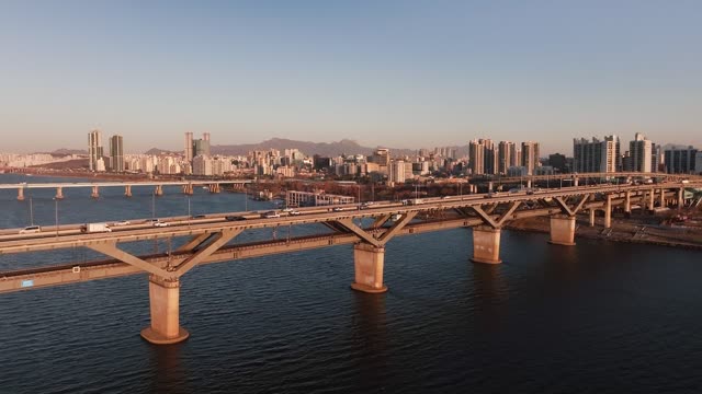 Seoul, Gwangjin-gu, Cheongdam Bridge, subway train, downtown and ...