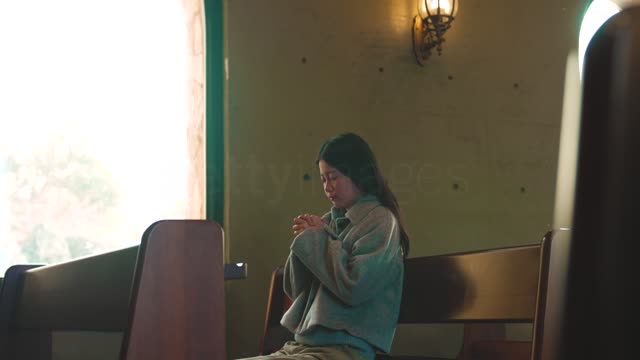 Trip to Gangwon-do, Pyeongchang-gun, young woman praying in church with ...