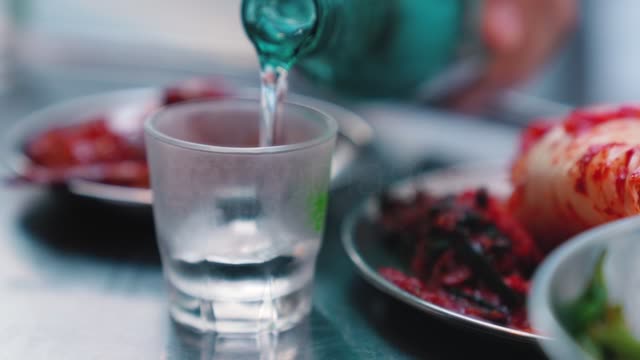 Scene of pouring Soju into shot glass / South Korea 회원제 무료동영상 ...