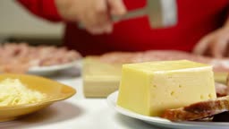 Food preparation& meat& cheese and vegetables on the kitchen table in ...