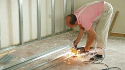 Installation of gypsum plasterboard ceilings - cutting drywall track ...