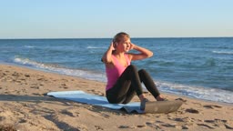 Fitness routine for women - athletic girl doing abdominal crunch on the ...
