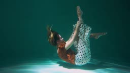 UNDERWATER DANCING Young beautiful professional elegant dancer woman ...