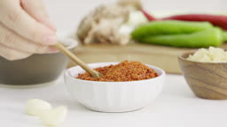 Kitchen in studio - Scooping red pepper powder (Ingredient of Soybean ...