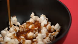 Studio shooting, high speed shooting - Pouring caramel syrup on turning ...