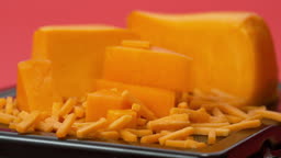 Studio shooting, high speed shooting - Piece of cheese falling on pile ...