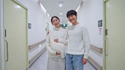 Hospital of Korea - Parturient woman and husband looking at camera and ...