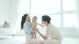 Newlywed - Young couple trying to soothe crying baby / South Korea ...