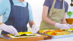 K-food - Cooking Class: Kimbab, foreign woman feeding another foreigner ...